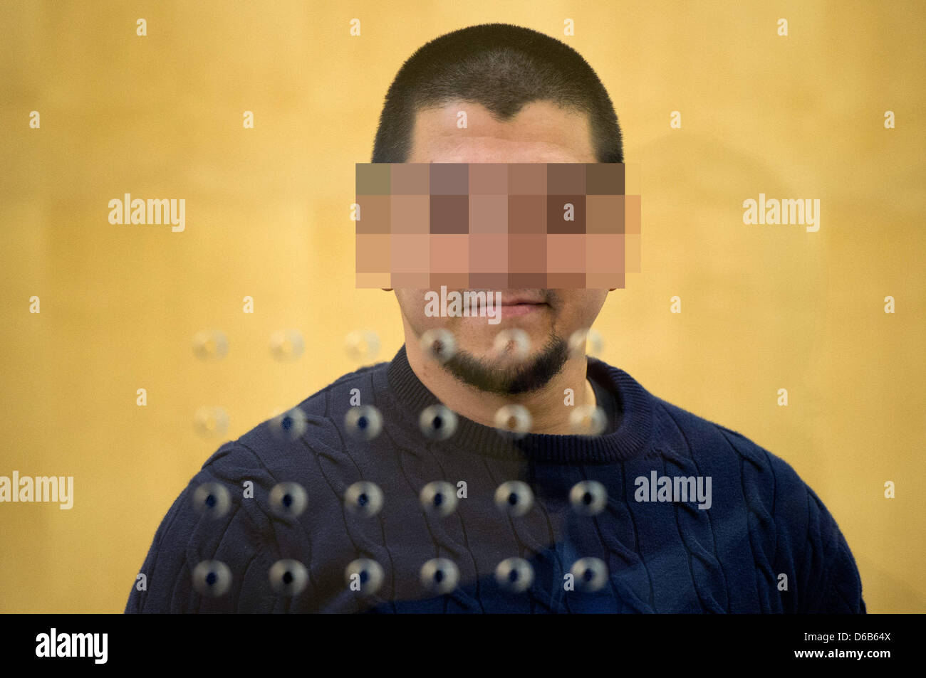 Ahmed K. is pictured behind a protection wall in the Higher Regional ...