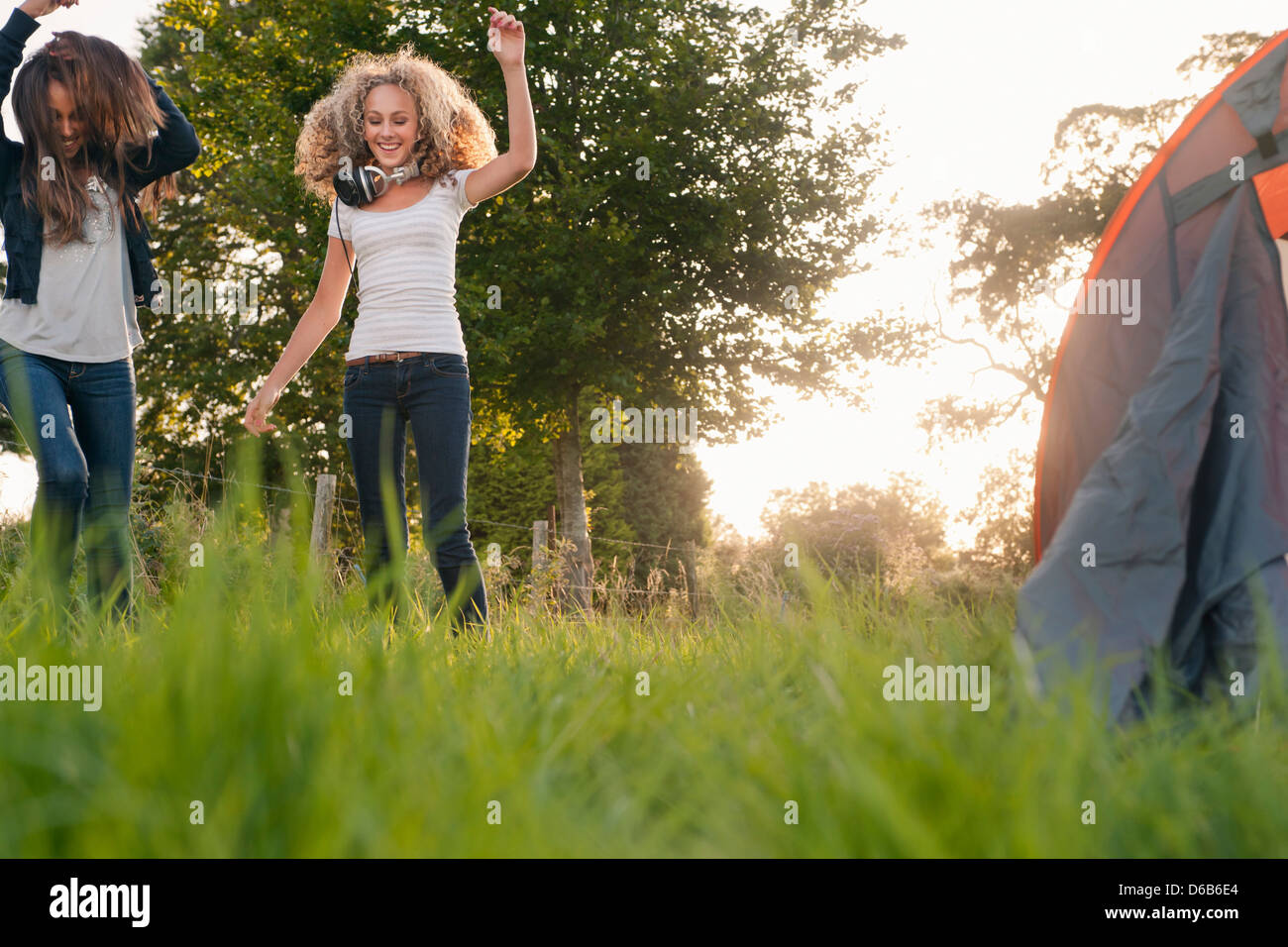 Teenage girls dancing in field Stock Photo - Alamy
