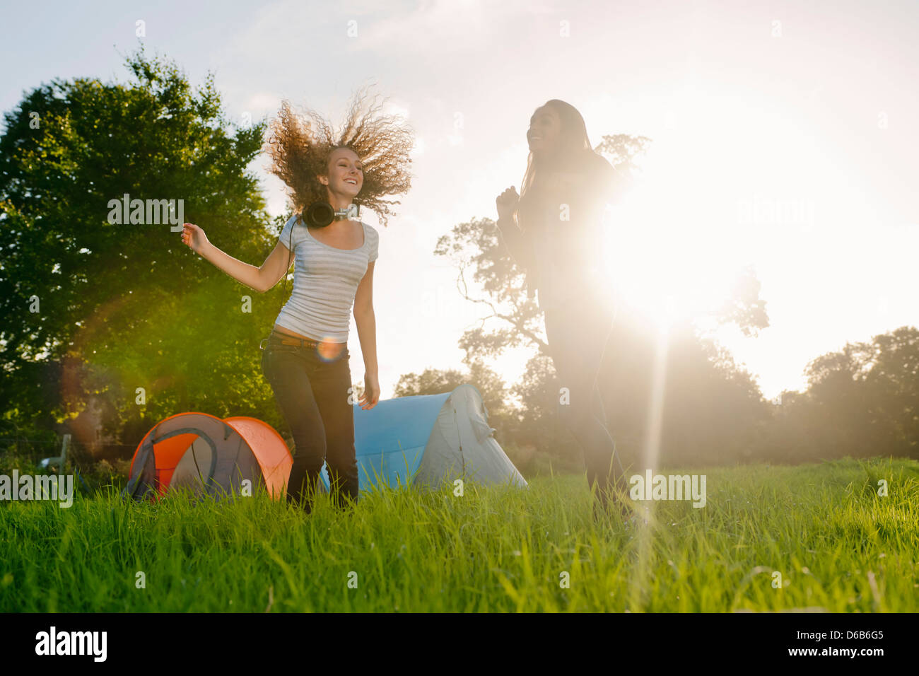 Teenage girls dancing in field Stock Photo - Alamy