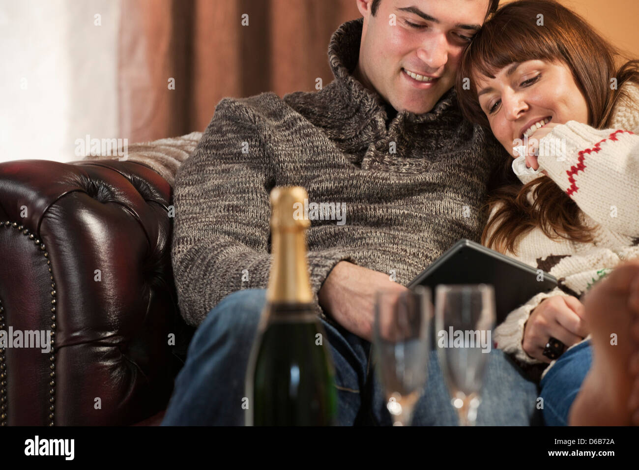 Woman with boyfriend crying at movie Stock Photo - Alamy
