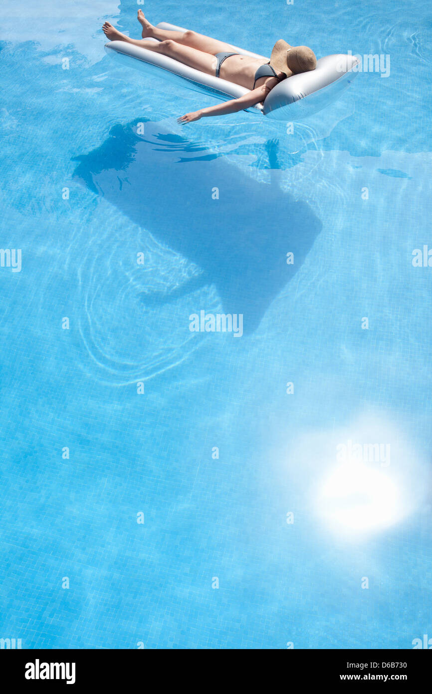 Person laying by the pool hi-res stock photography and images - Alamy