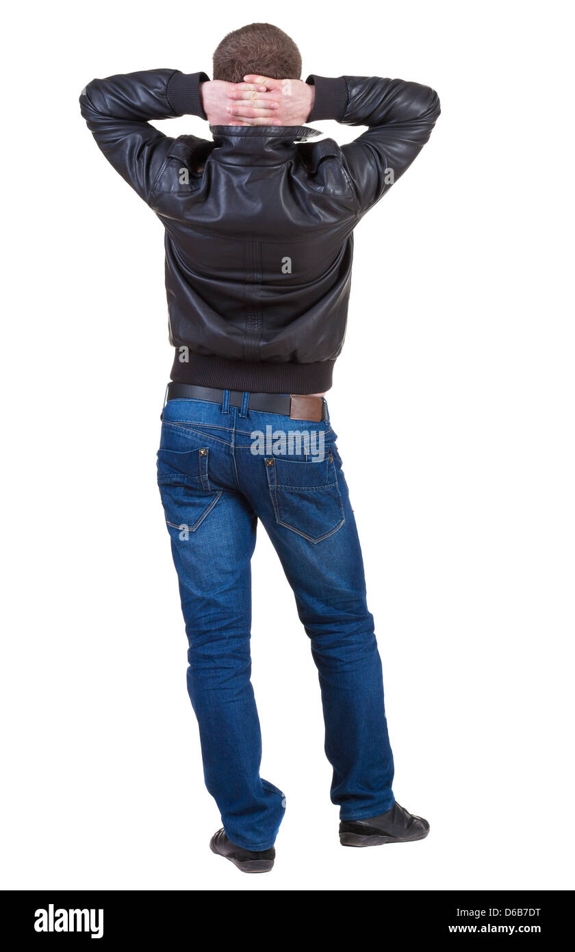 Back view of handsome man in jacket relaxed looks into the distance ...