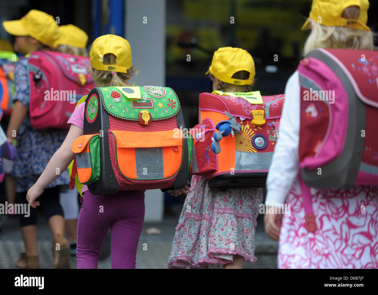 First graders enter a primary school together in Duesseldorf, Germany ...