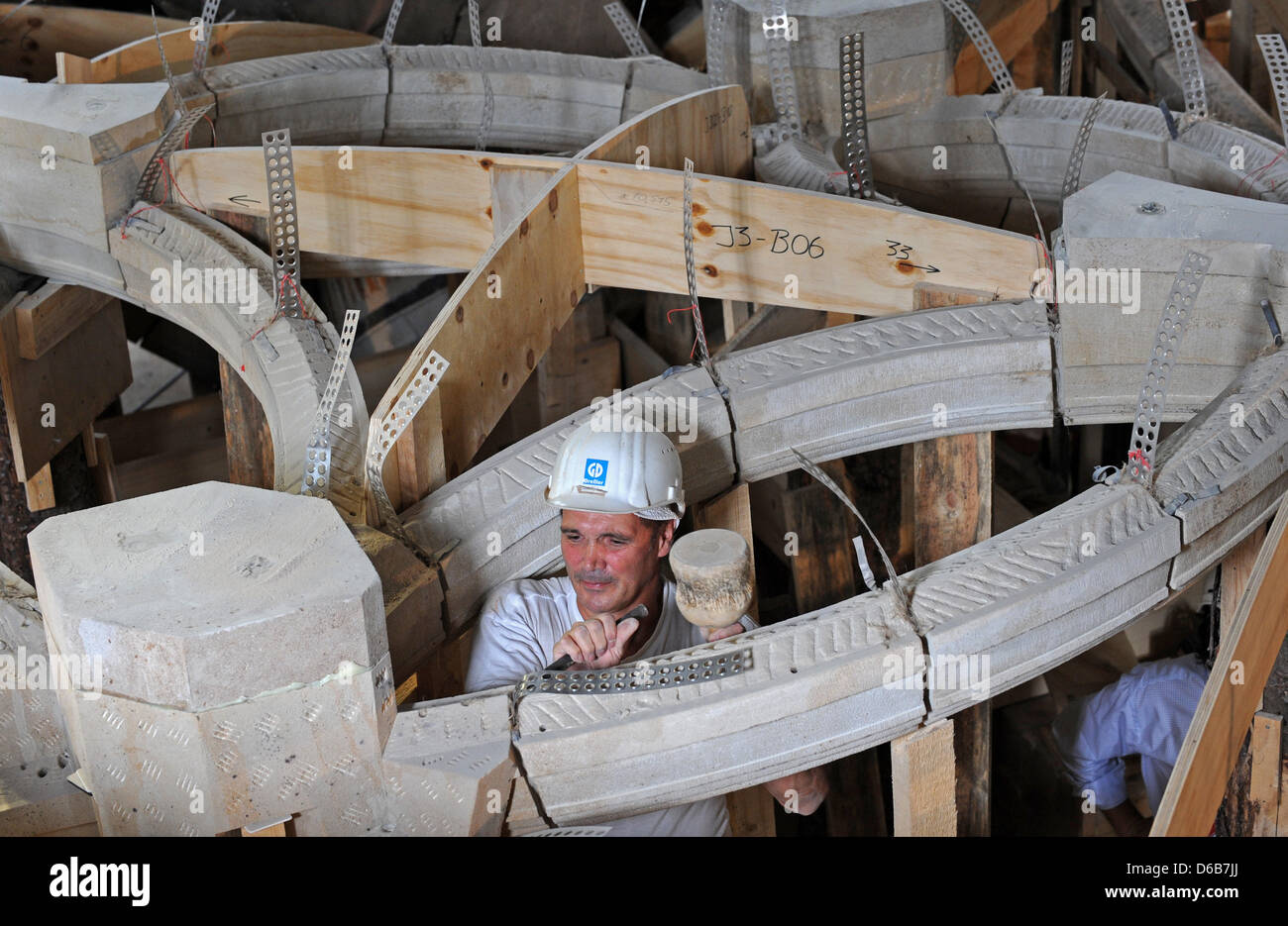 Stone mason Steffen Rauh works on a historic vault of the chapel of ...