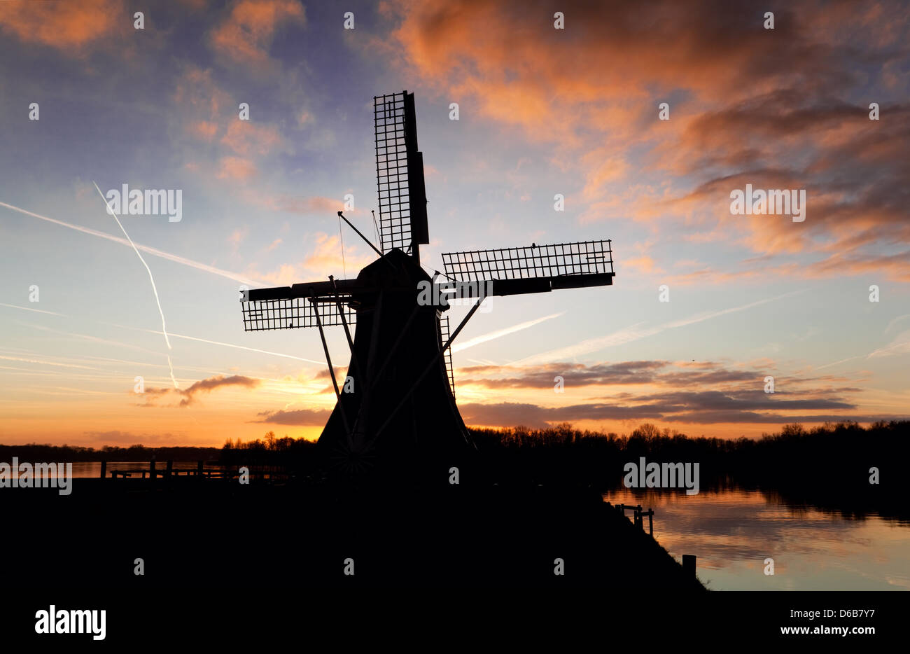 windmill silhouette at sunset Stock Photo - Alamy