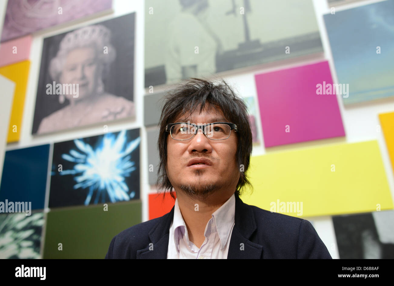 Documenta artist Yan Lei stands in front of his paintings at the ...
