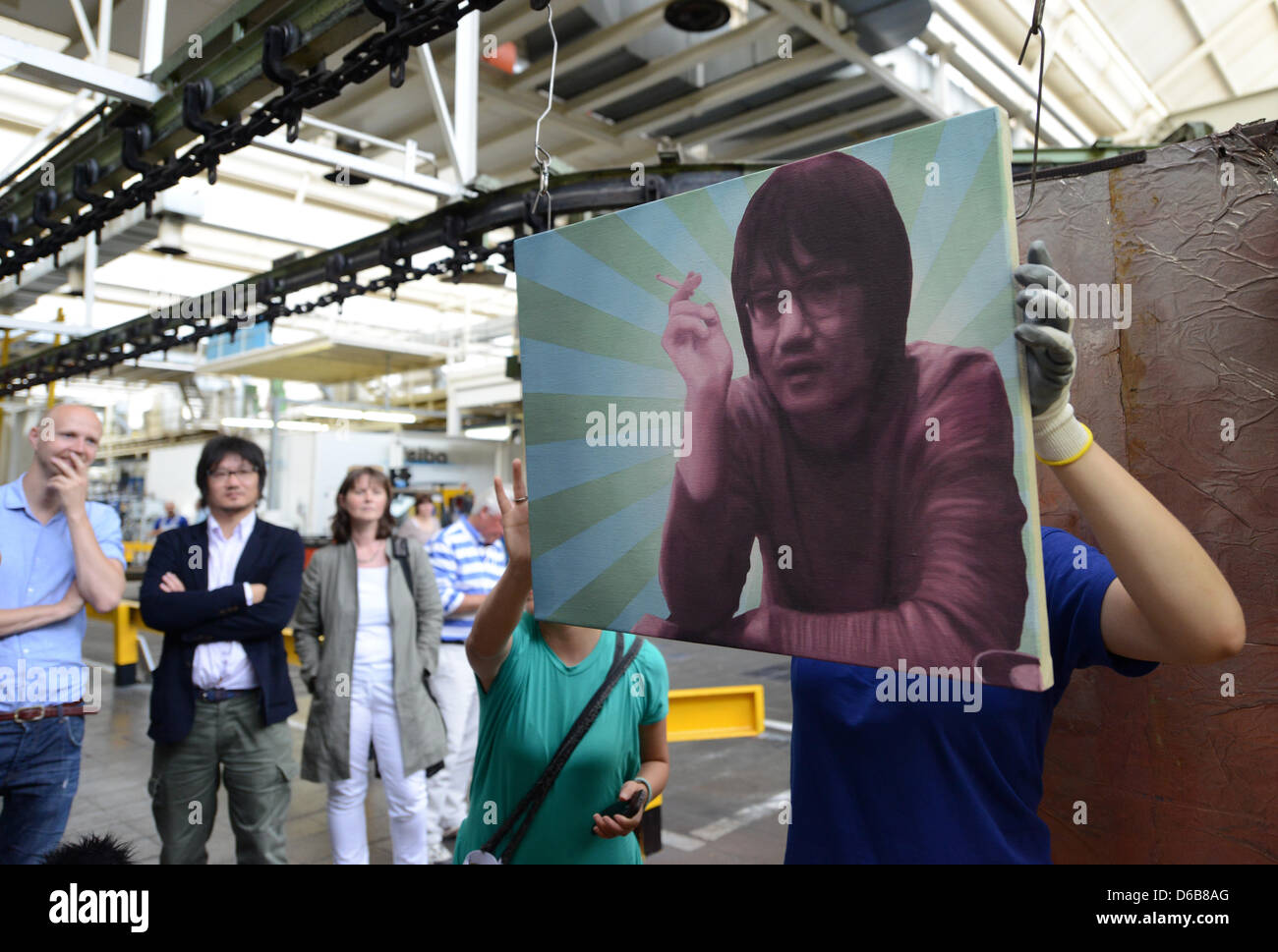 A self-portrait of documenta artist Yan Lei is hung for spray painting ...