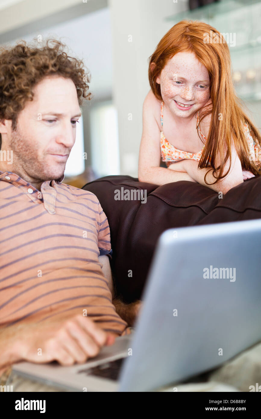 Father and daughter using laptop Stock Photo - Alamy