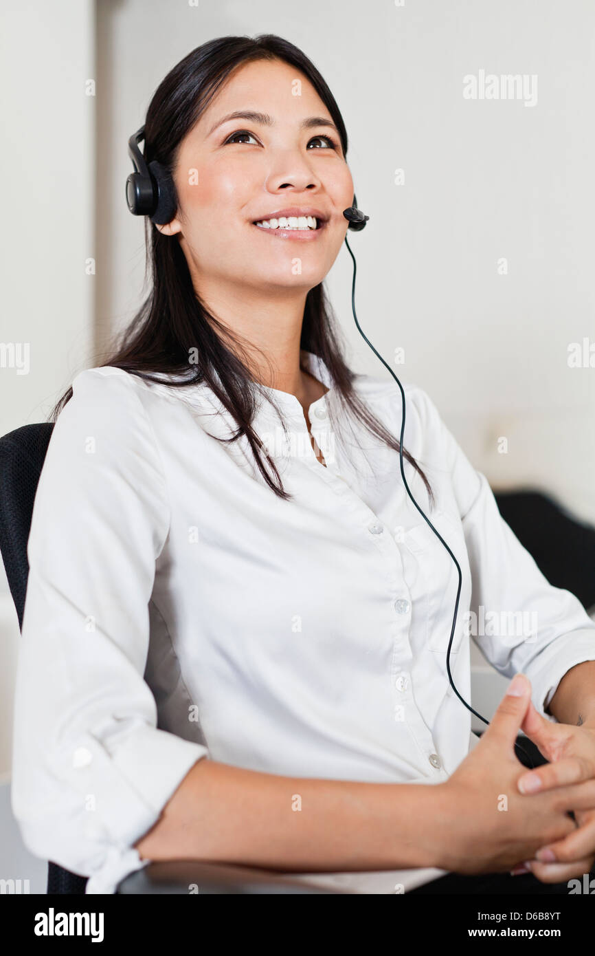 Businesswoman wearing hands free device hi-res stock photography and ...