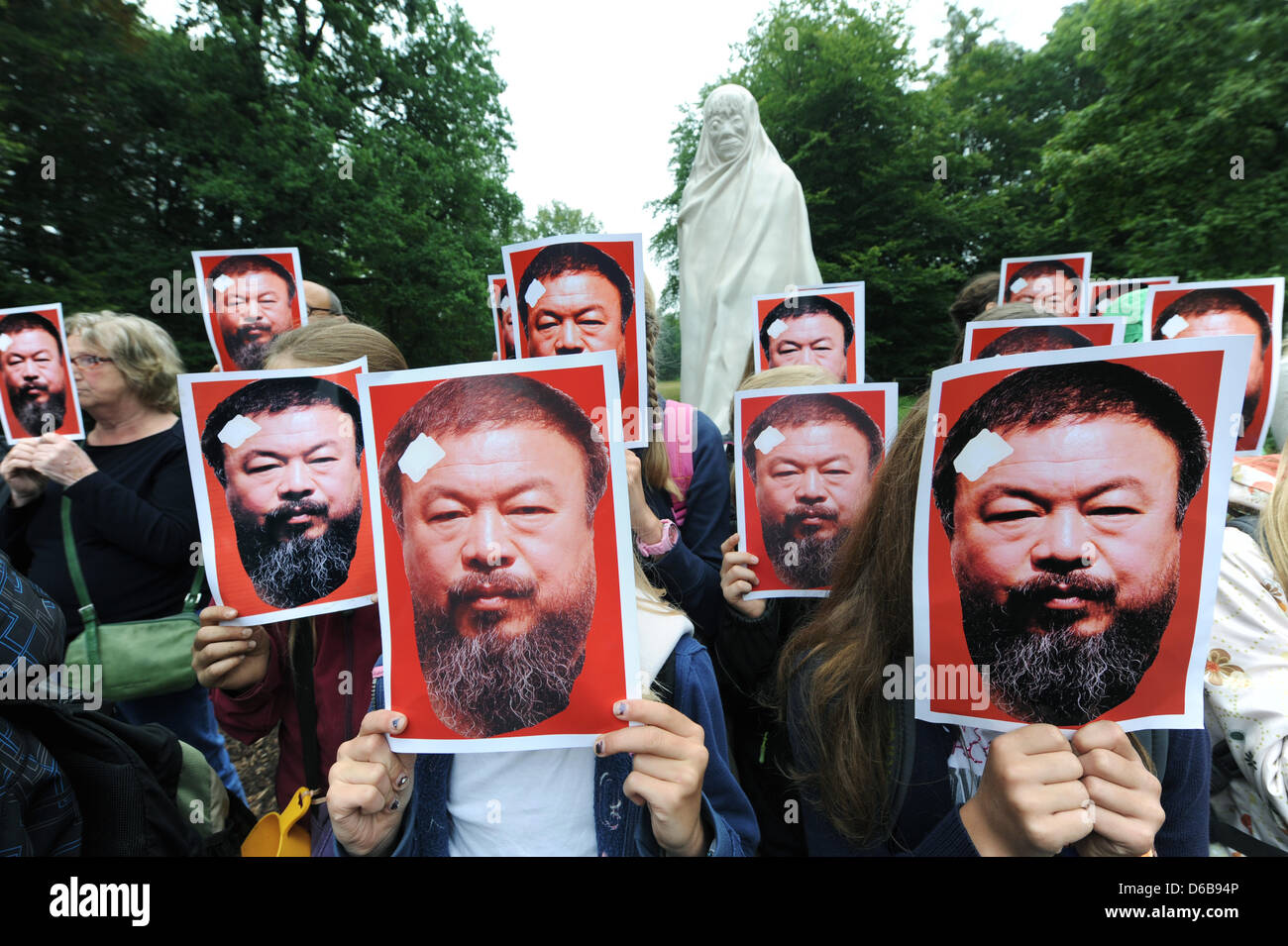 Visitors of the contemporary art show documenta attend a protest action ...