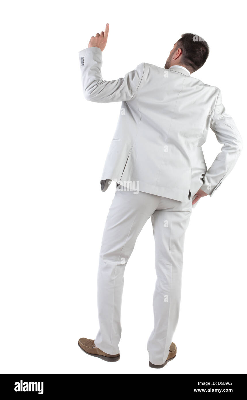 Back view of thinking young business man in white suit. Rear view ...