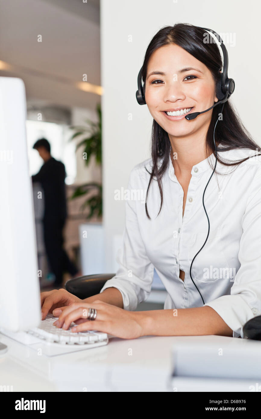 Businesswoman wearing hands free device hi-res stock photography and ...