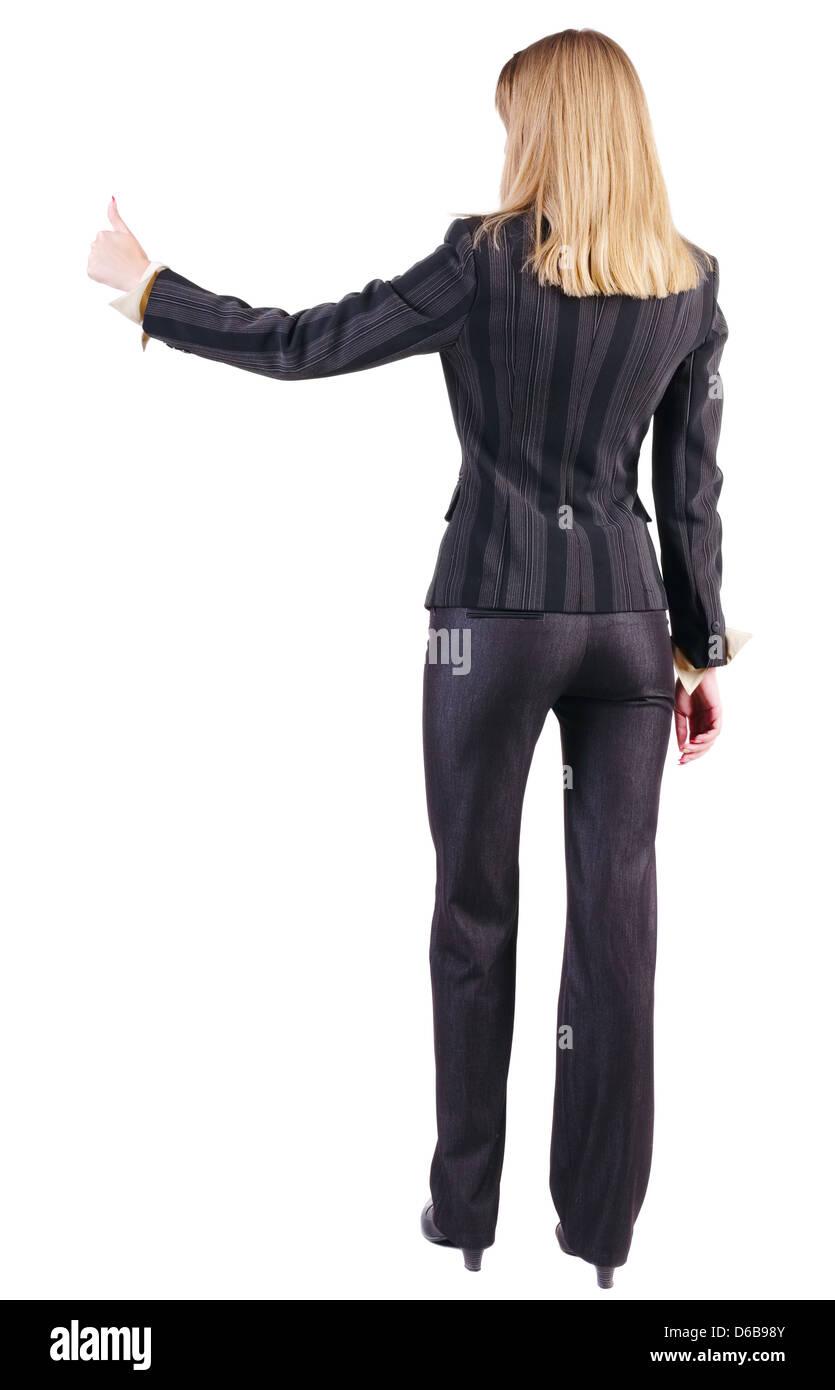 back view of standing young blonde business woman showing thumb up ...