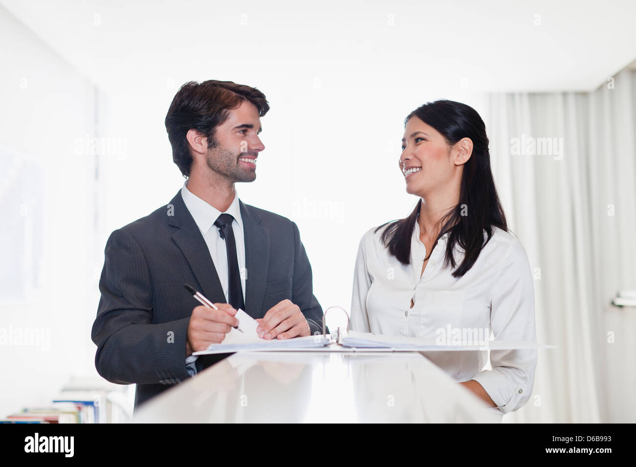 Business people smiling together Stock Photo - Alamy