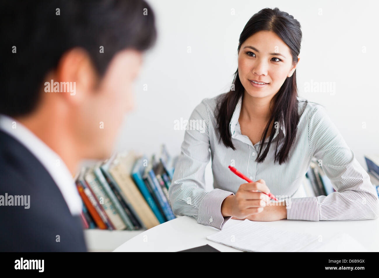 Business people talking at desk Stock Photo - Alamy