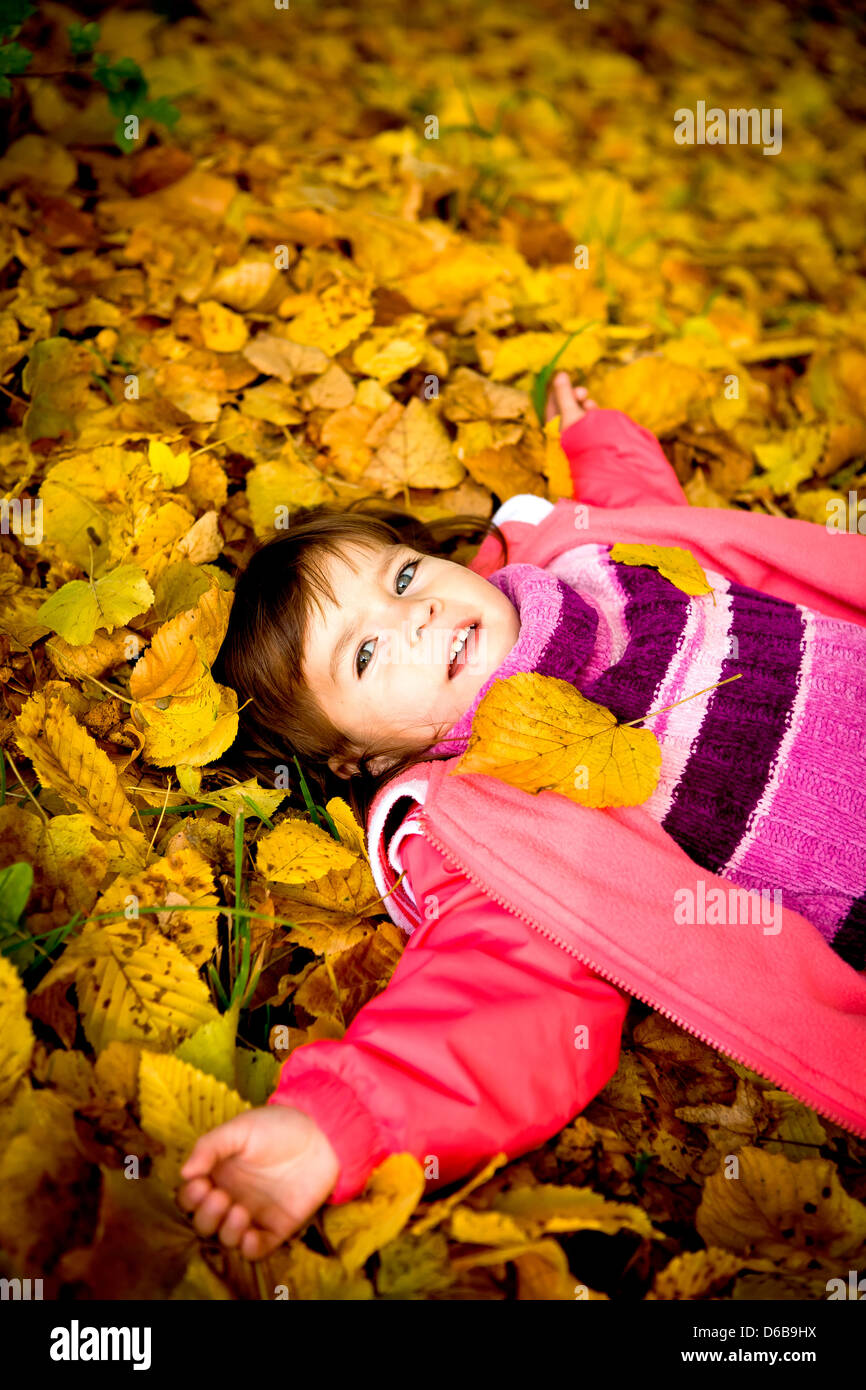 little girl in the autumn park Stock Photo - Alamy