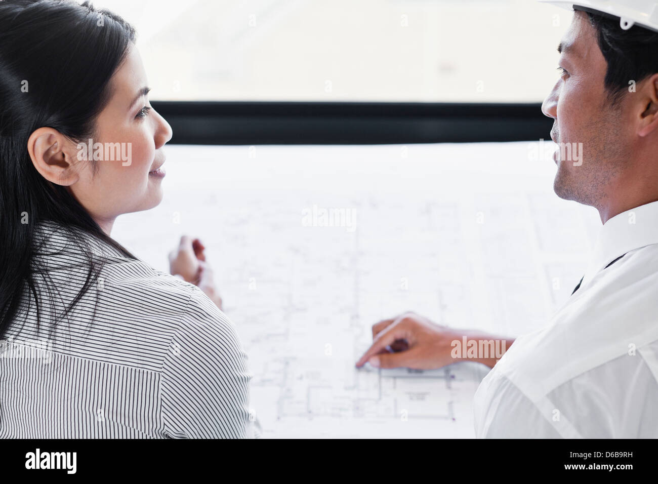 Business people working on blueprints hi-res stock photography and ...