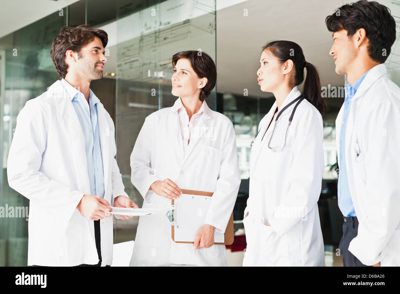 Doctors talking in hallway Stock Photo - Alamy