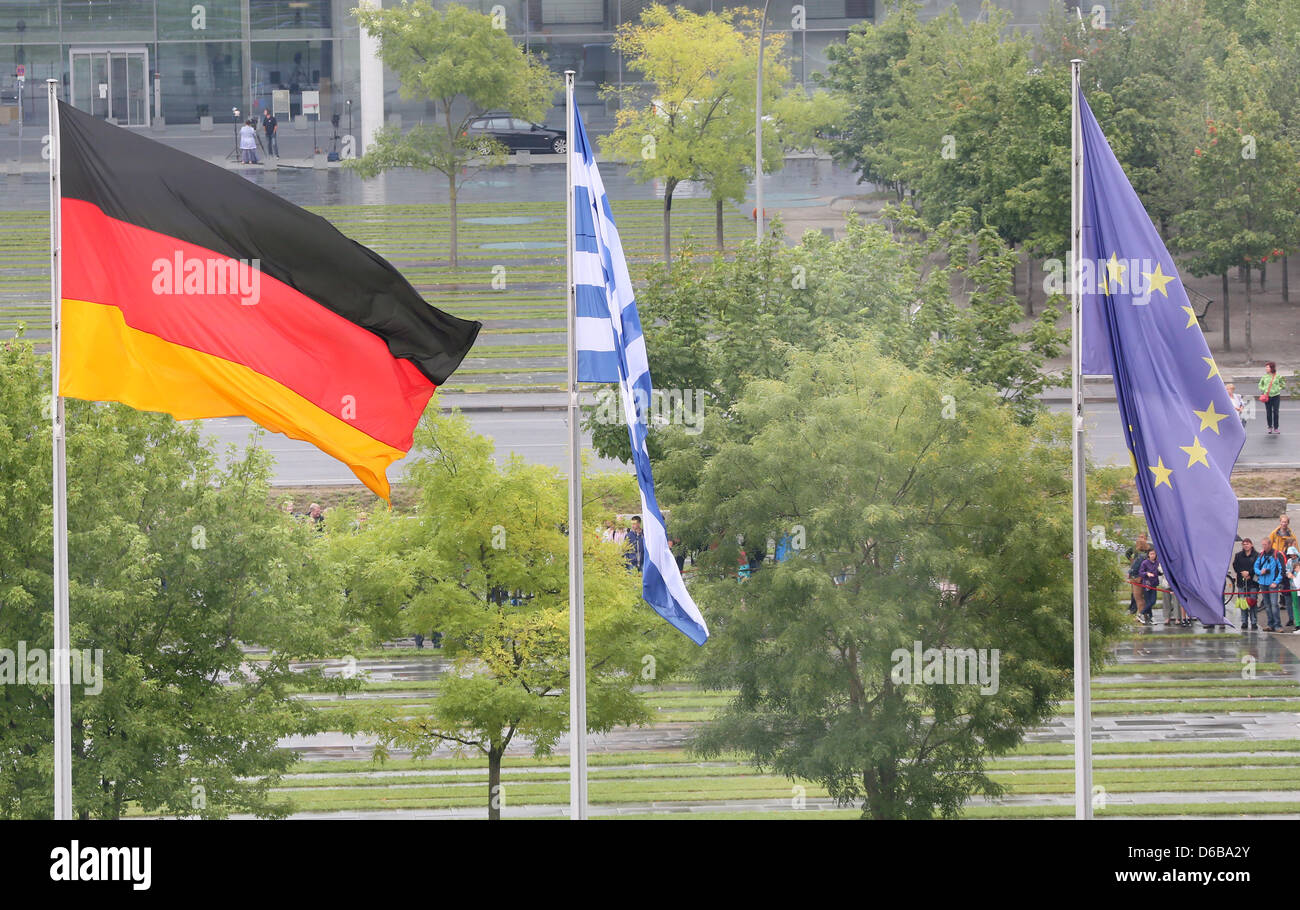 The German, Greek and European flag are visible at the Chancellery in ...