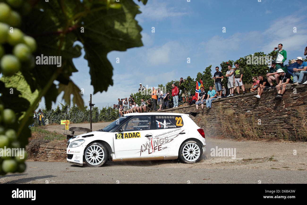 French rally driver Sebastien Ogier, last year's winner, and co-driver ...