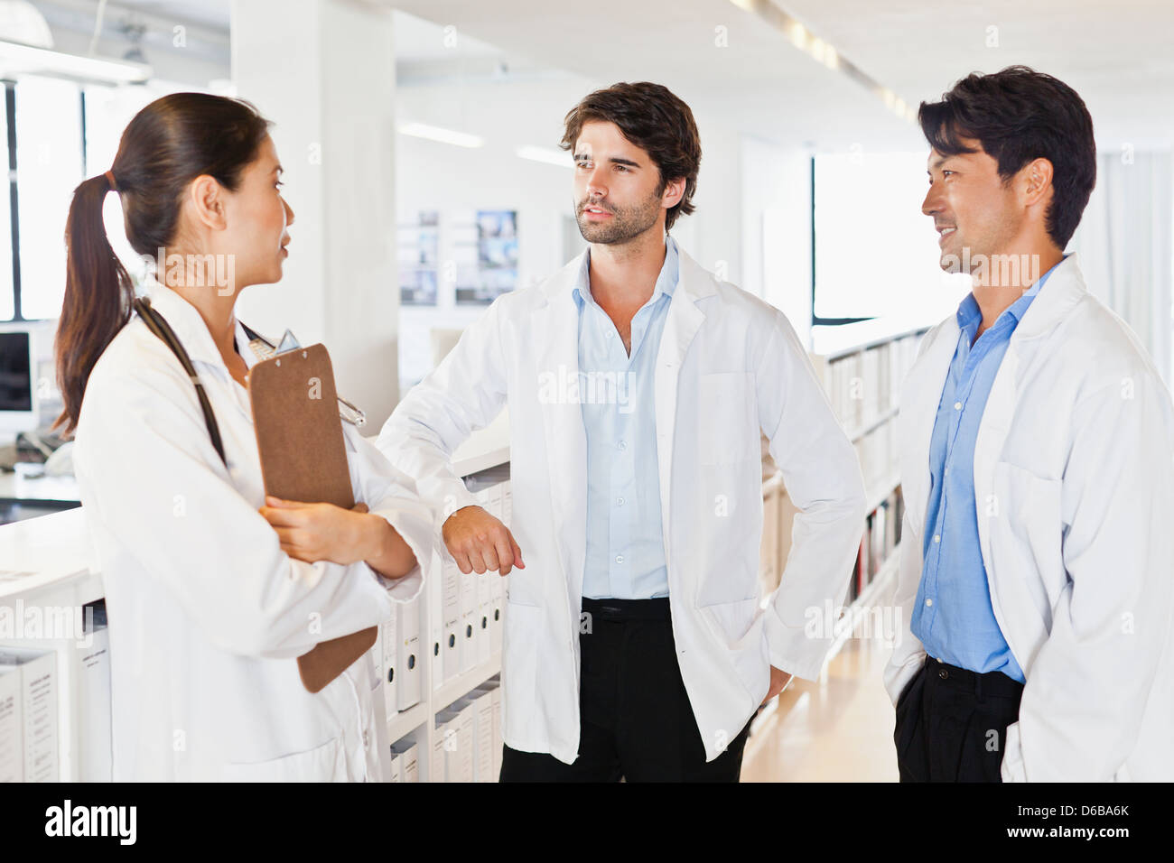 Doctors talking in hallway Stock Photo - Alamy