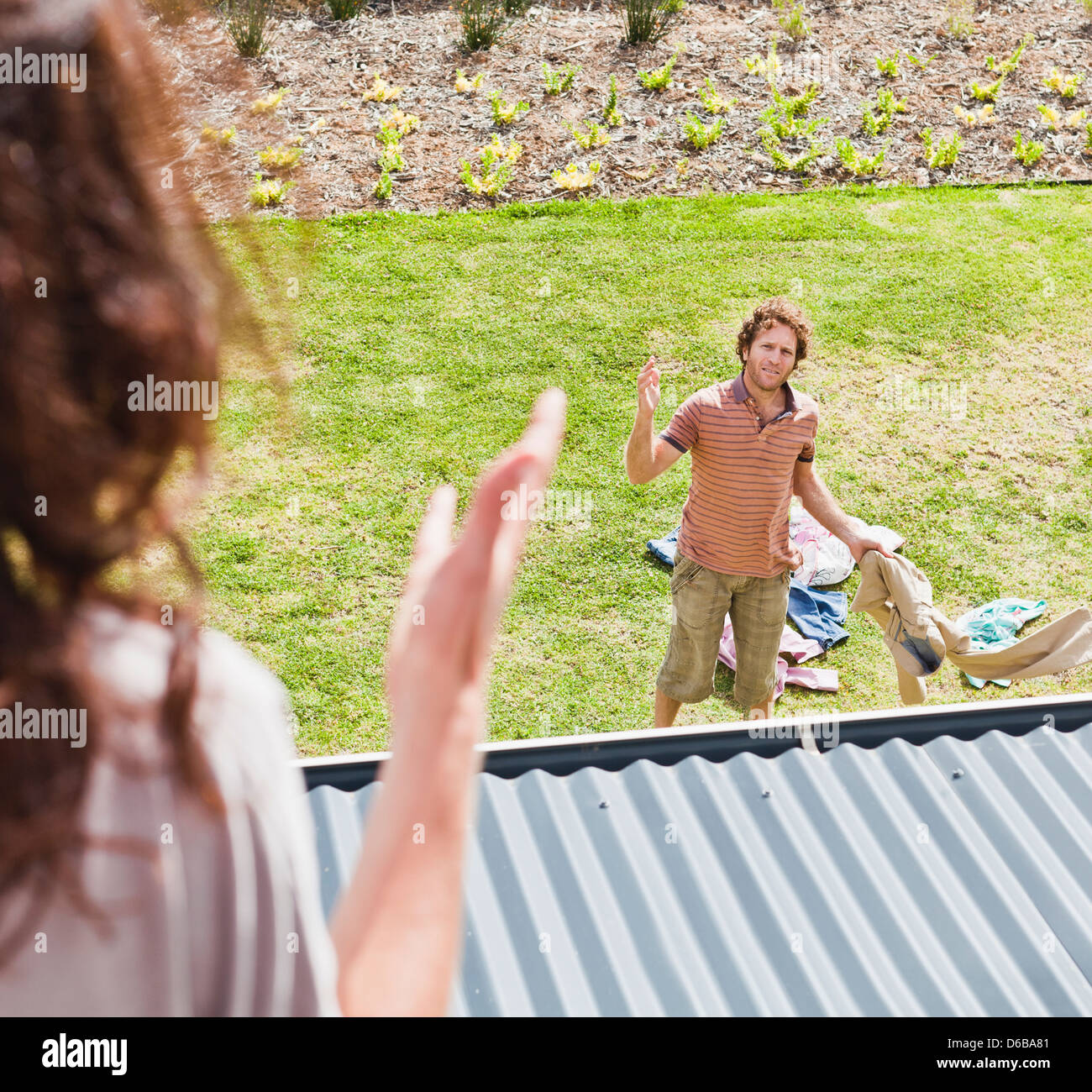 Woman arguing with boyfriend in backyard Stock Photo - Alamy