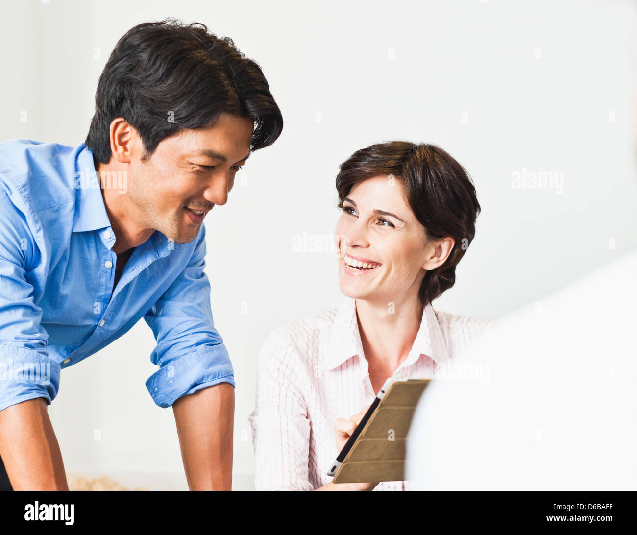 Business people talking at desk Stock Photo - Alamy