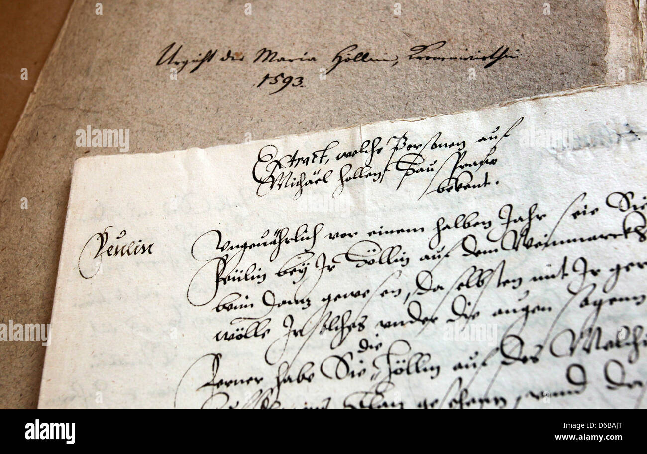 The hand written original witch trial records lie on a table in the ...