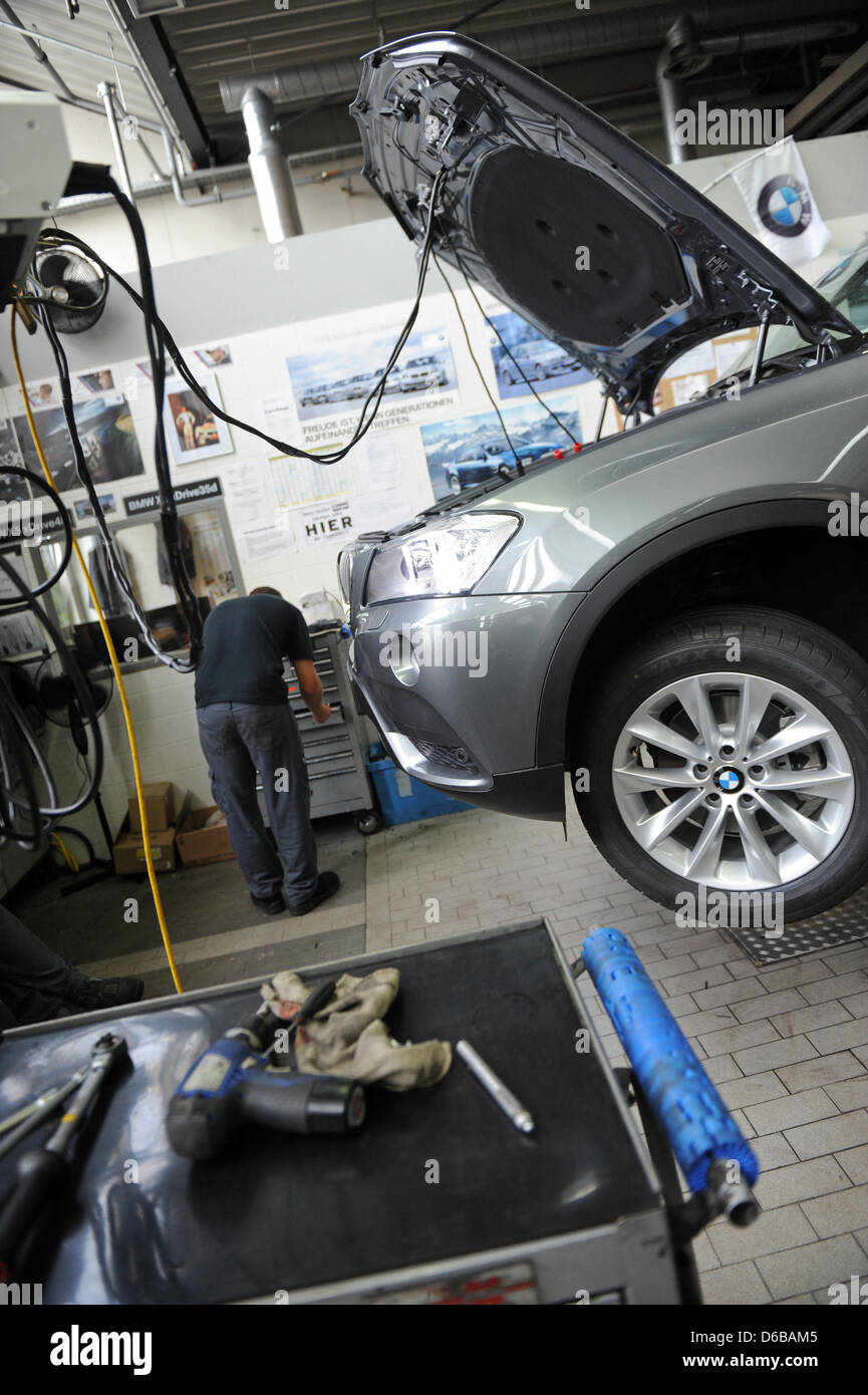 (ILLUSTRATION) An illustration shows a car sitting in the a BMW ...