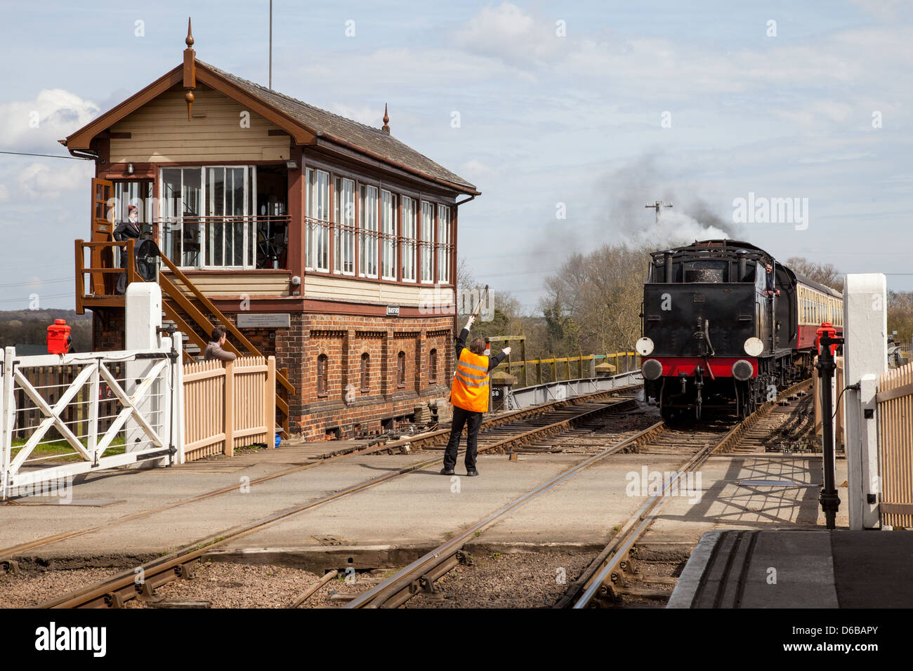 Railway Crossing and Steam Train Stock Photo - Alamy
