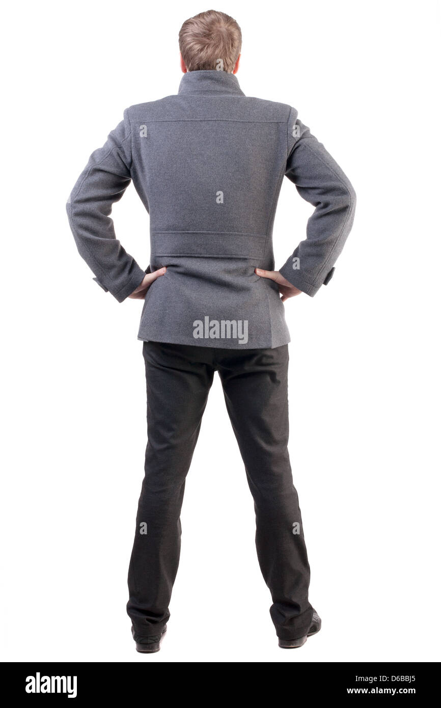 Back view of handsome business man in coat. Standing young businessman ...