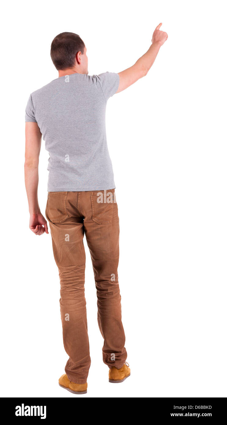 Back view of pointing young men in shirt and jeans. Young guy gesture ...