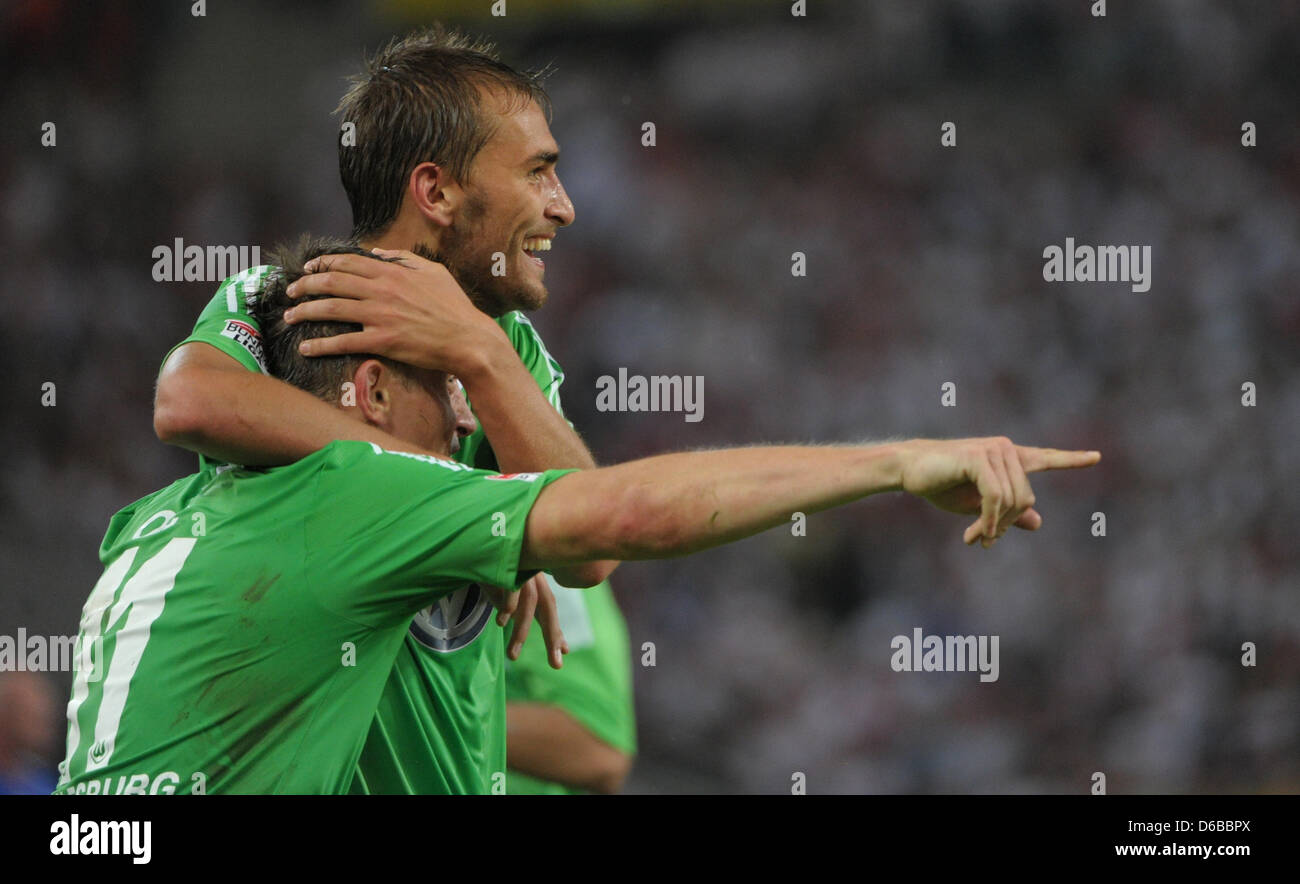 Wolfsburg's Bas Dost (above) celebrates his 1-0 goal with Ivica Olic ...