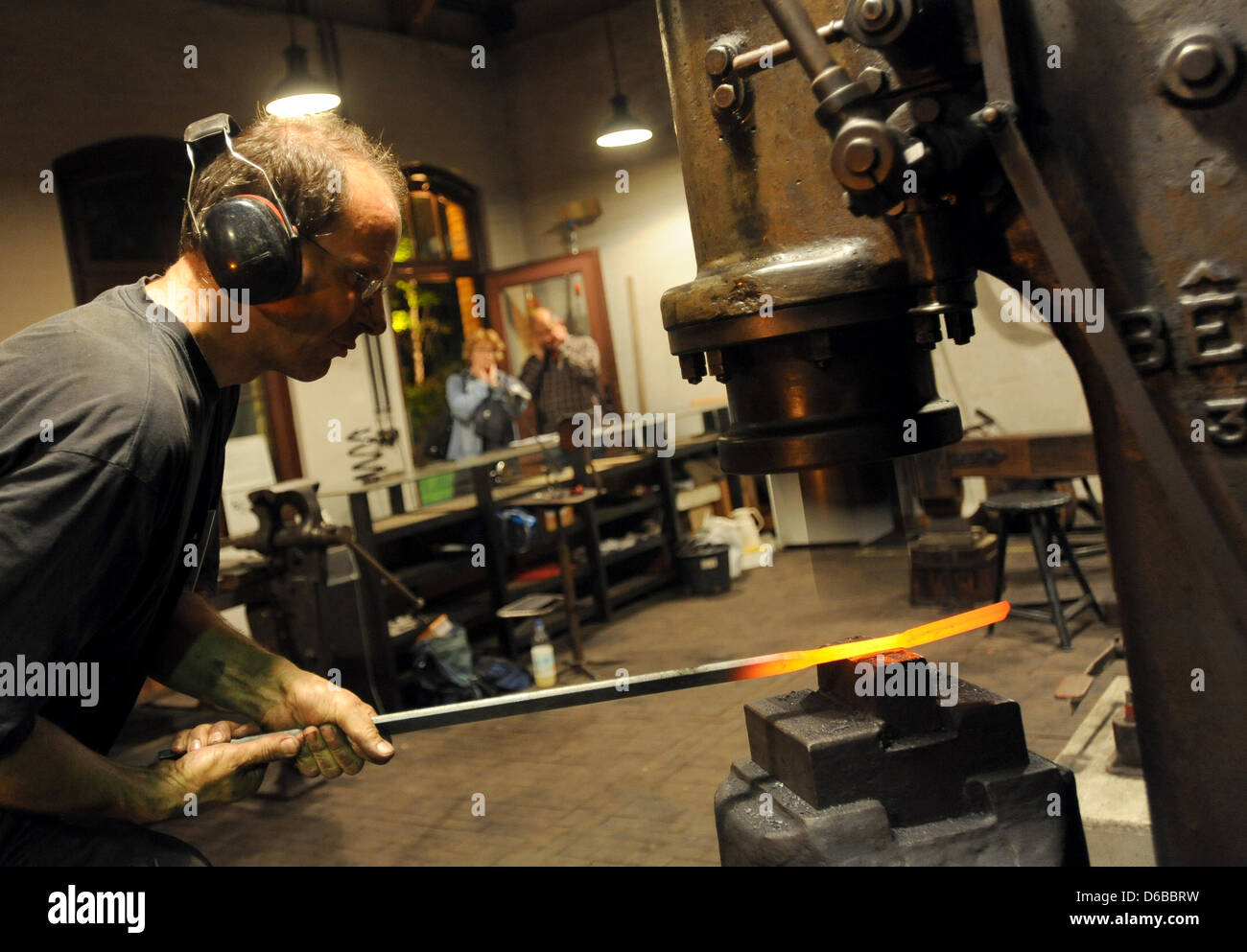 Blacksmith Werner Mohrmann-Dressel performs his skills at the German ...