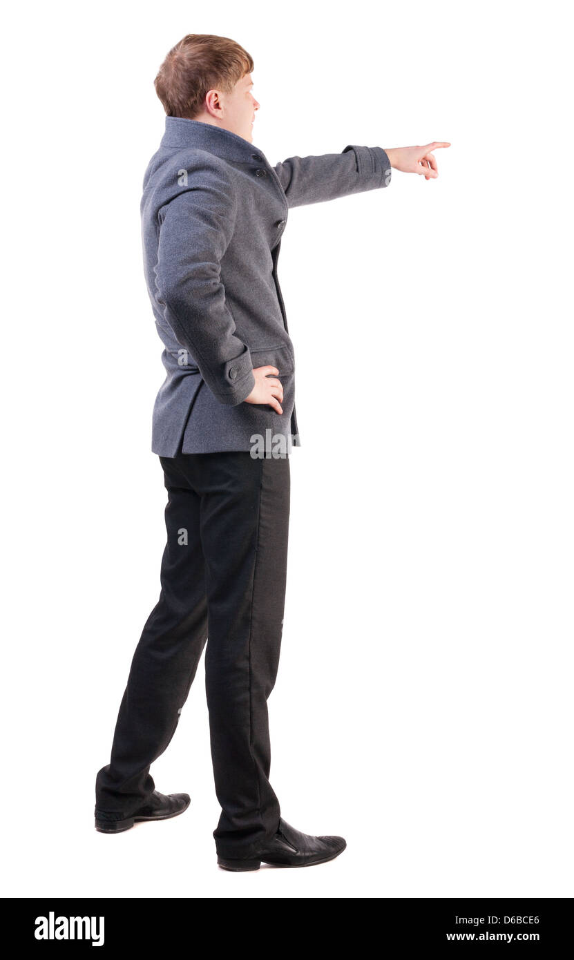 Back view of pointing young business men in coat. Blonde businessman ...