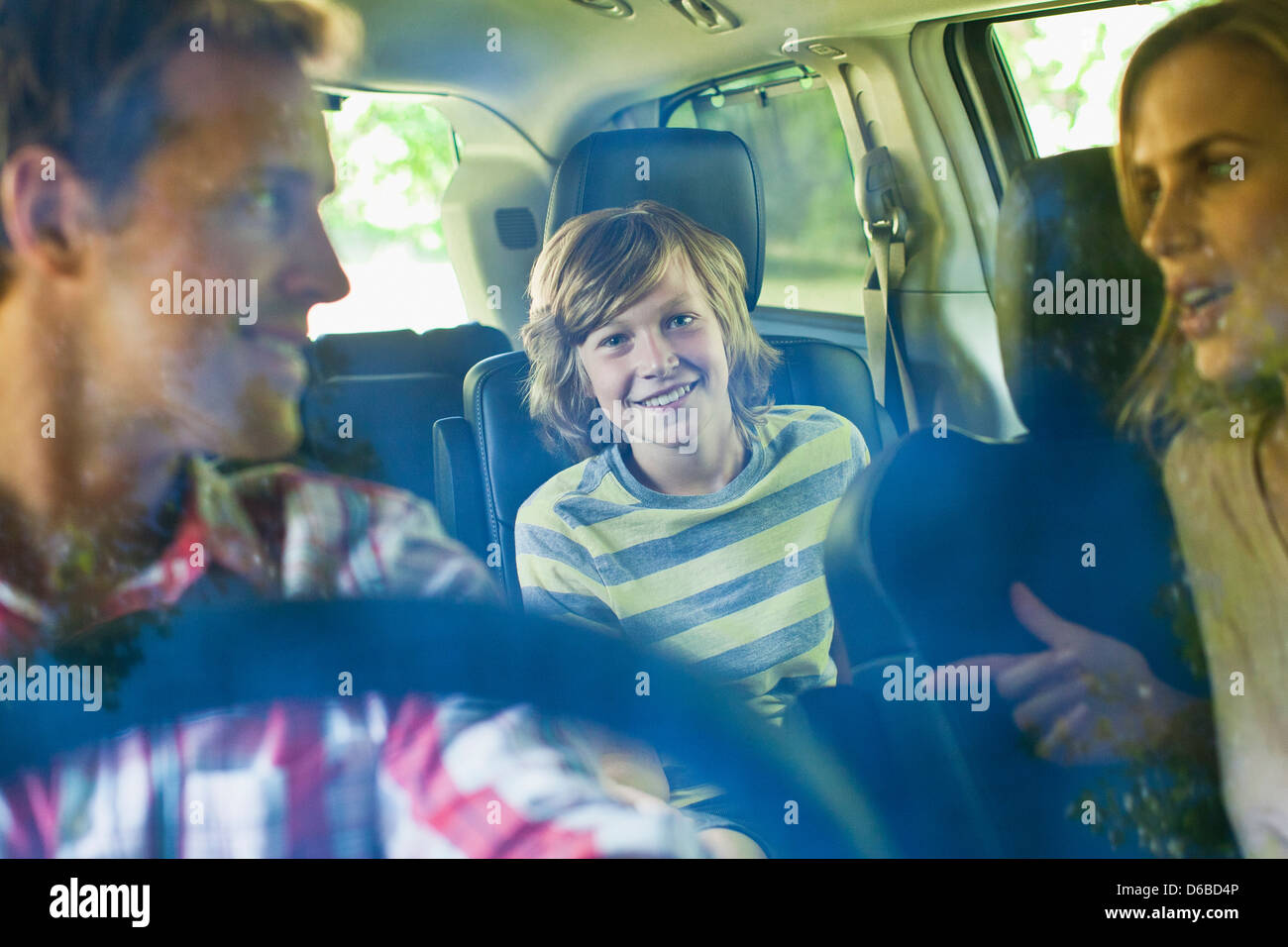 Family riding in car together Stock Photo - Alamy