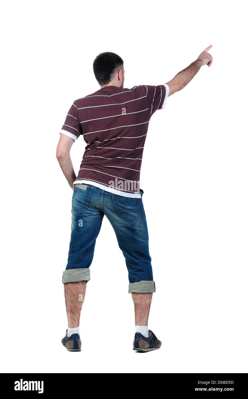 Young man pointing at wall. Rear view. Isolated over white Stock Photo ...