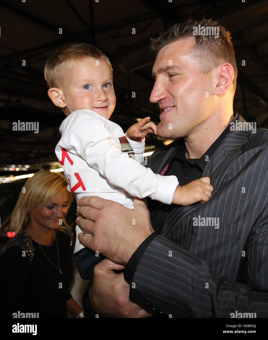 Heavy weight boxer Mariusz Wach (R) from Poland is welcomed by his son ...