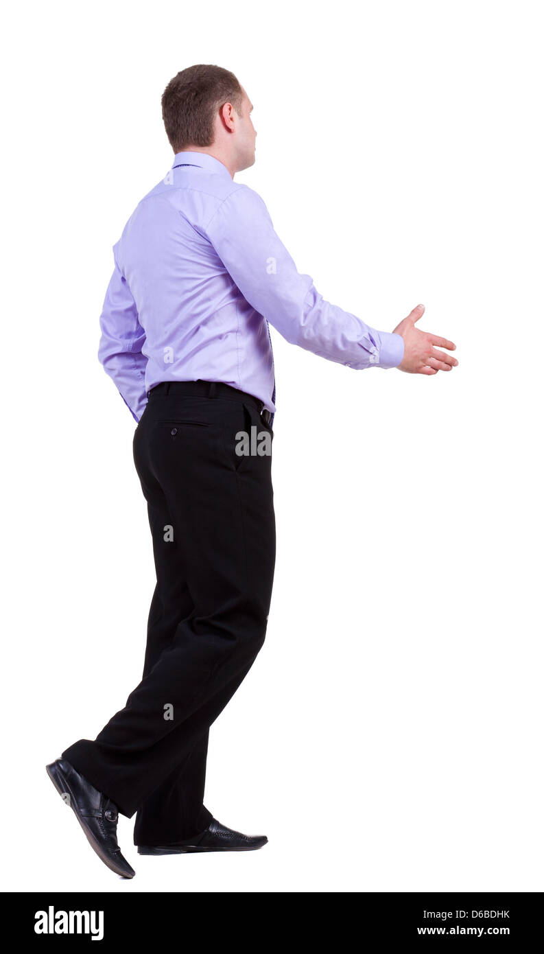 Back view of walking business man in trousers and shirt, hand shake ...