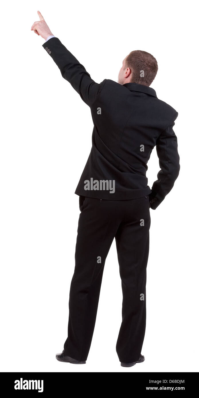 Back view of pointing business man. Gesticulating young guy in black ...