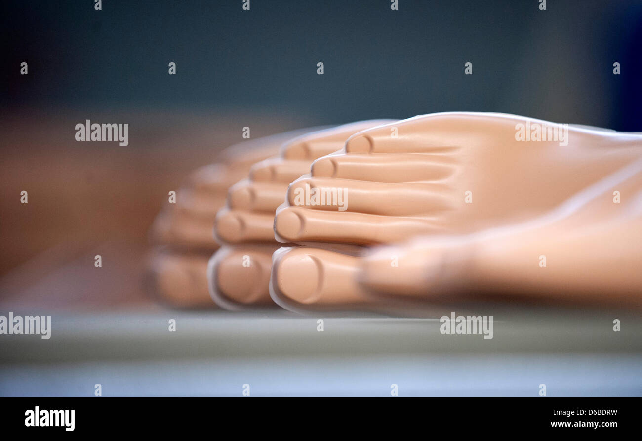 Prosthetic feet made from polyurethane sit on a shelf at the medical ...
