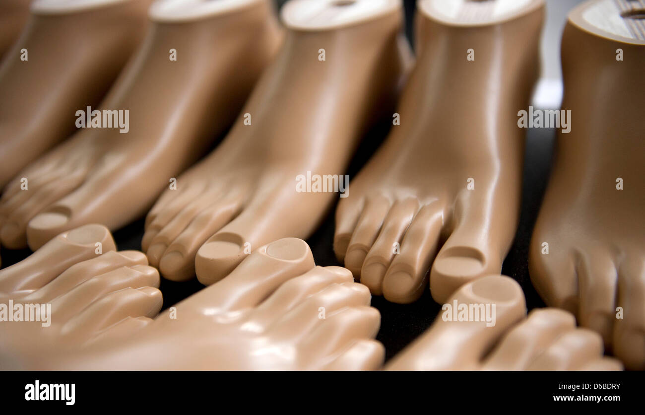 Prosthetic feet made from polyurethane sit on a shelf at the medical ...