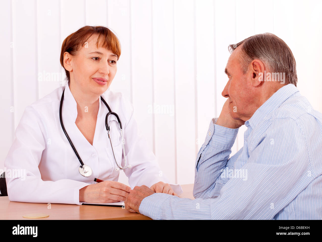 elderly man on survey of doctor Stock Photo - Alamy