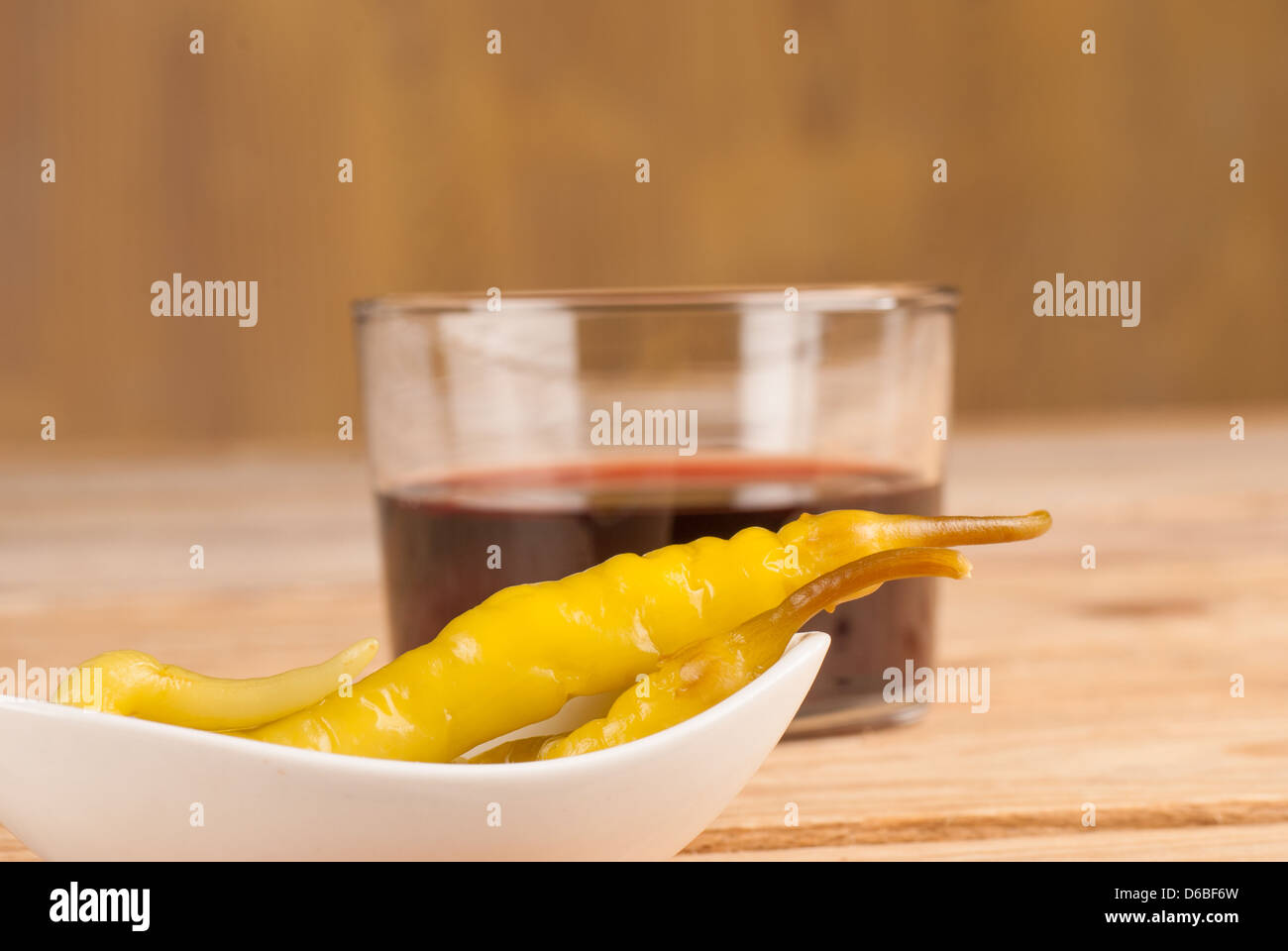 Guindillas, a hot Spanish pepper served pickled with a glass of wine ...