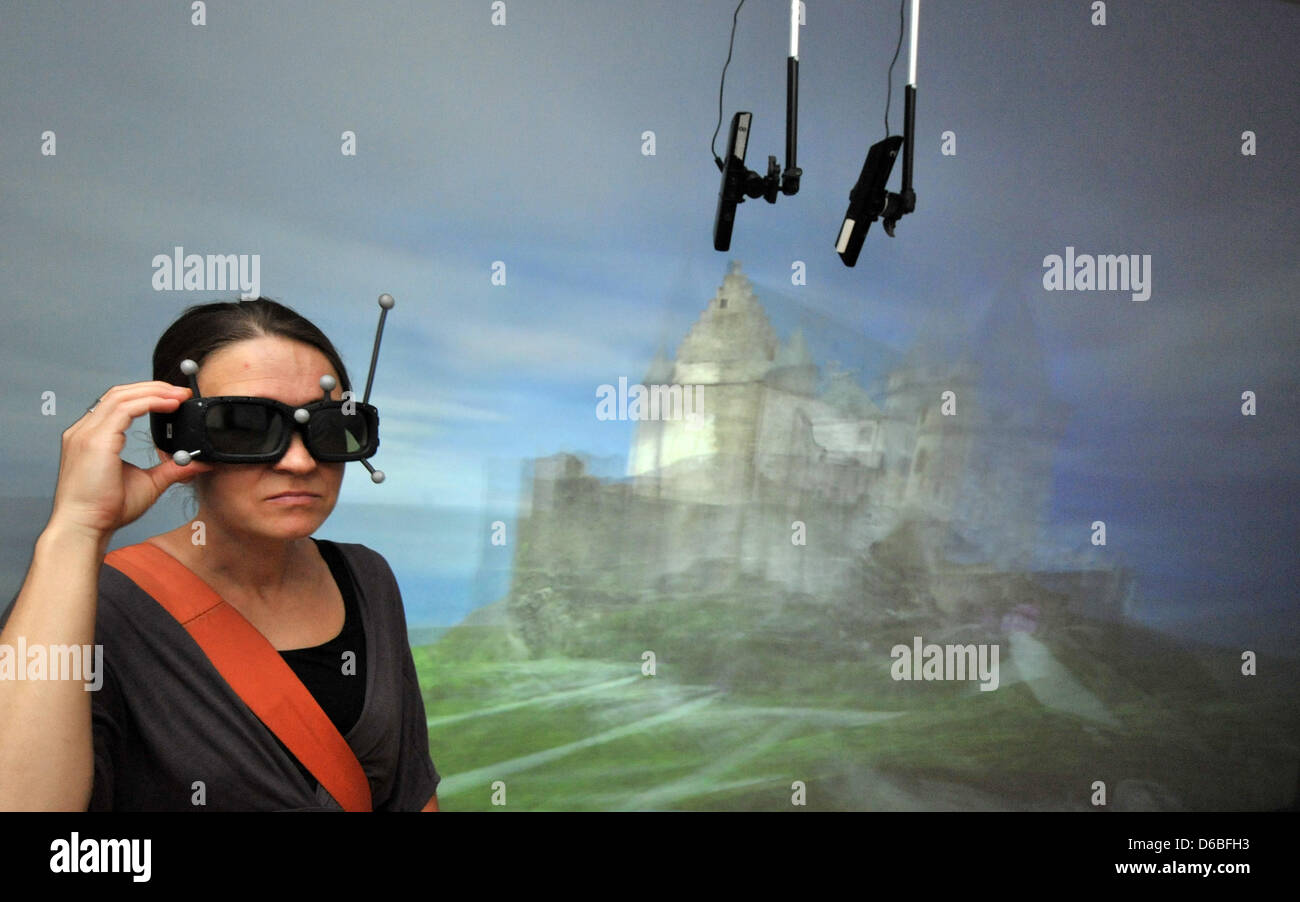 A young woman views a multiple user stereo projection with shutter ...