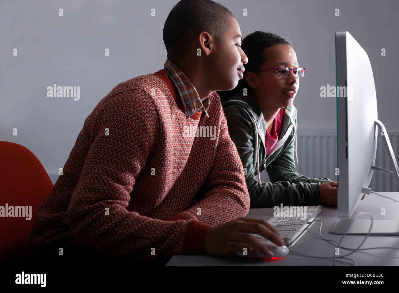 Children using computer together Stock Photo - Alamy