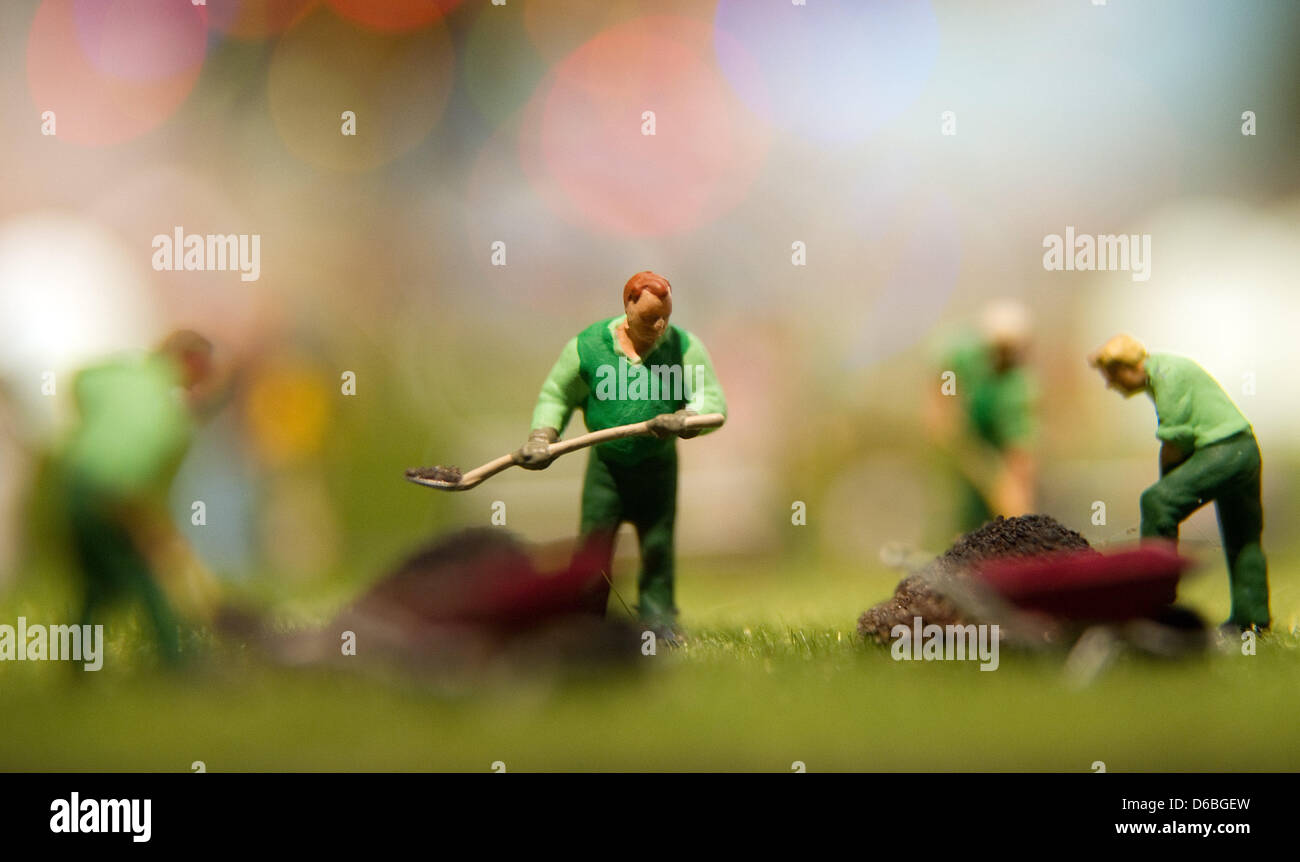 Model figures of gardeners stand on a 3 sq m big model of the ...