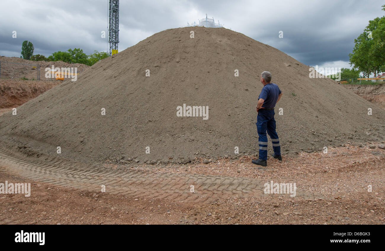Bomb disposer Frank Bender looks at a hill of sand under which a 500kg ...