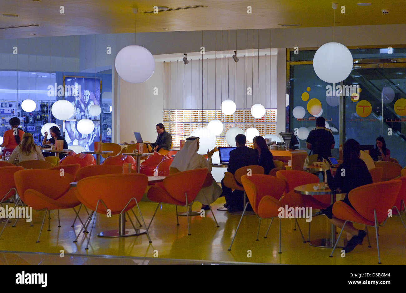 Dubai, people in a coffee bar of the Emirates Tower shopping center ...