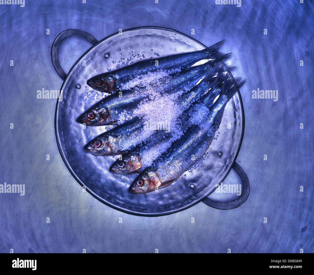 Fish with salt on metal plate Stock Photo - Alamy